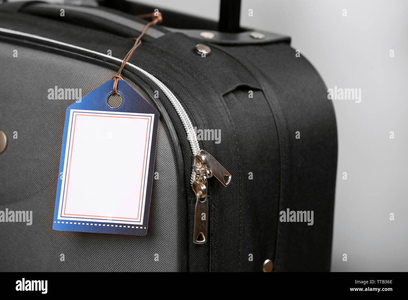 Suitcase with TRAVEL INSURANCE label, closeup Stock Photo - Alamy