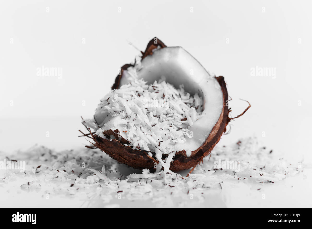 Coconut shavings in coconut isolated white Stock Photo - Alamy
