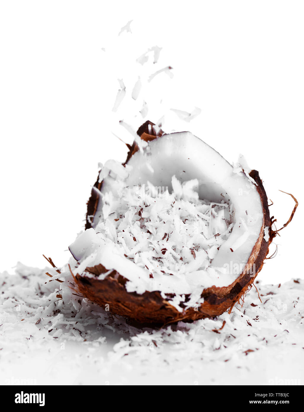 Coconut shavings in coconut isolated white Stock Photo - Alamy