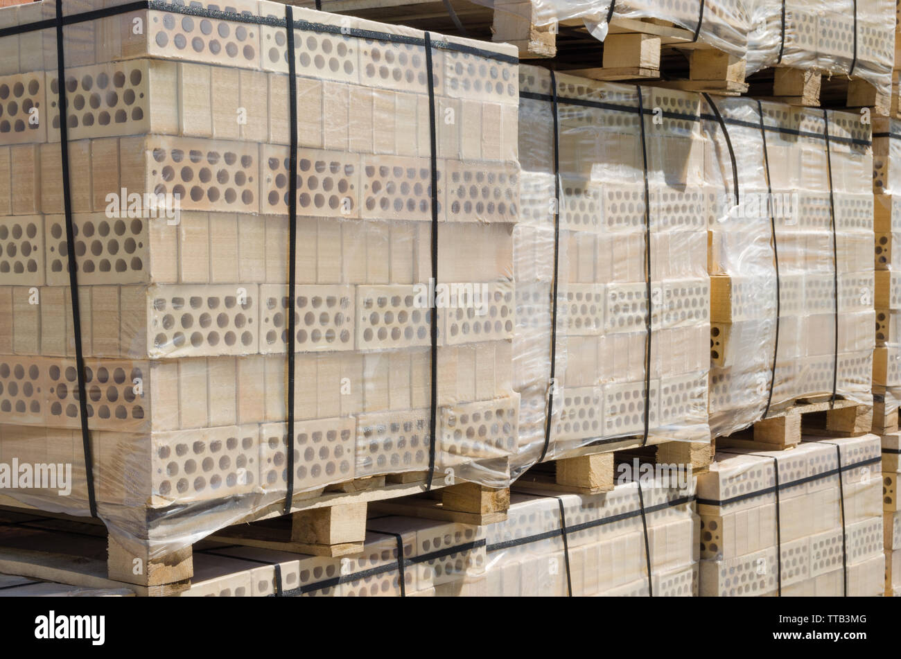 Large number of pallets of yellow brick Stock Photo - Alamy