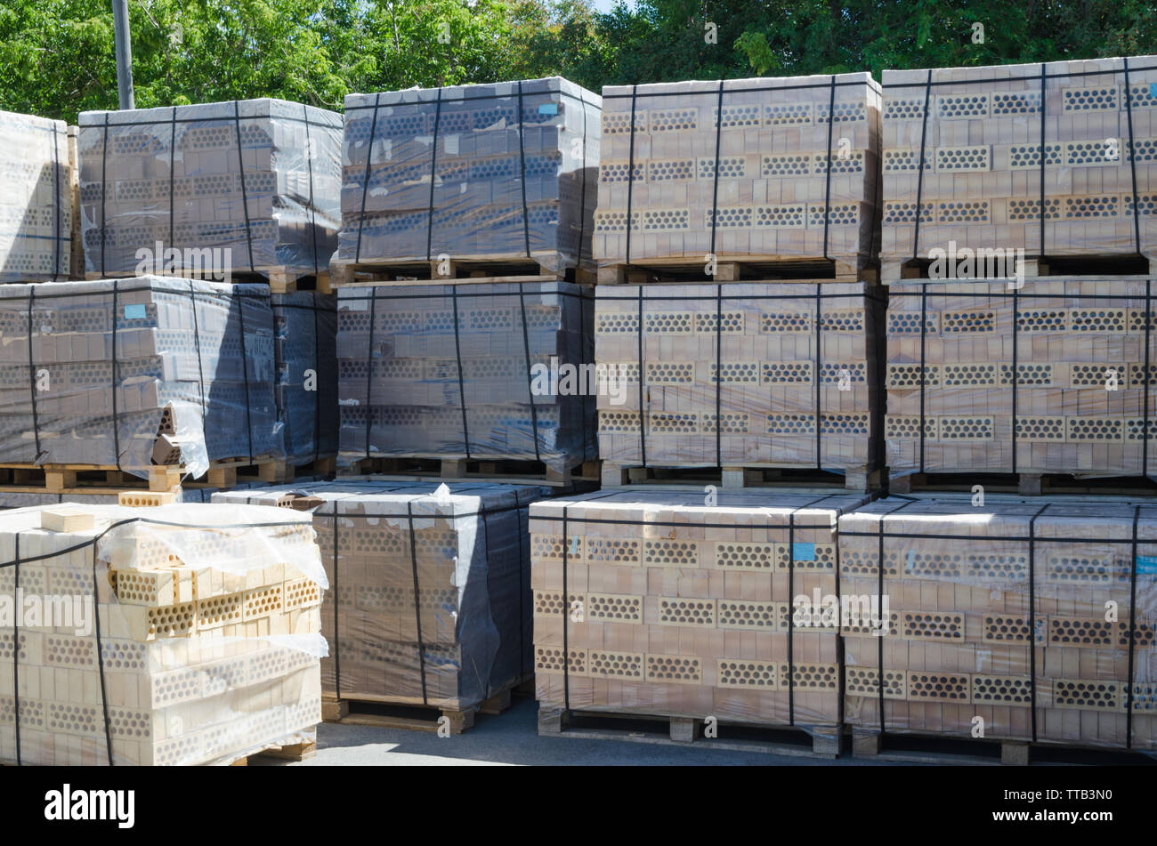 Large number of pallets of yellow brick Stock Photo - Alamy