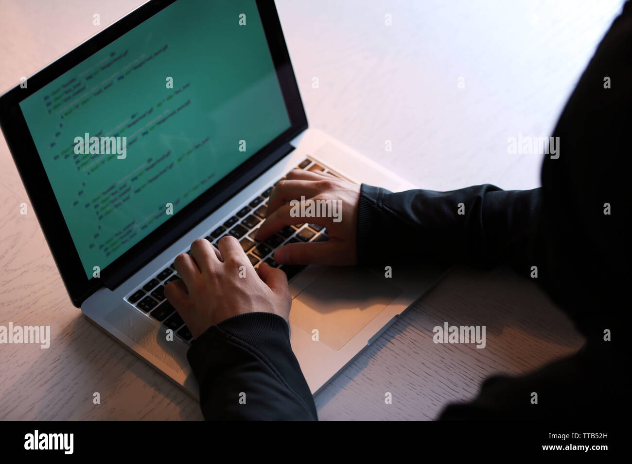 Hacker with laptop Stock Photo - Alamy