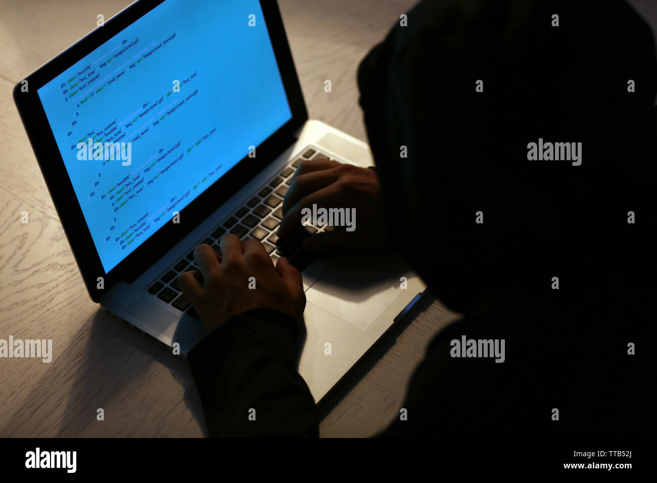 Hacker with laptop Stock Photo - Alamy