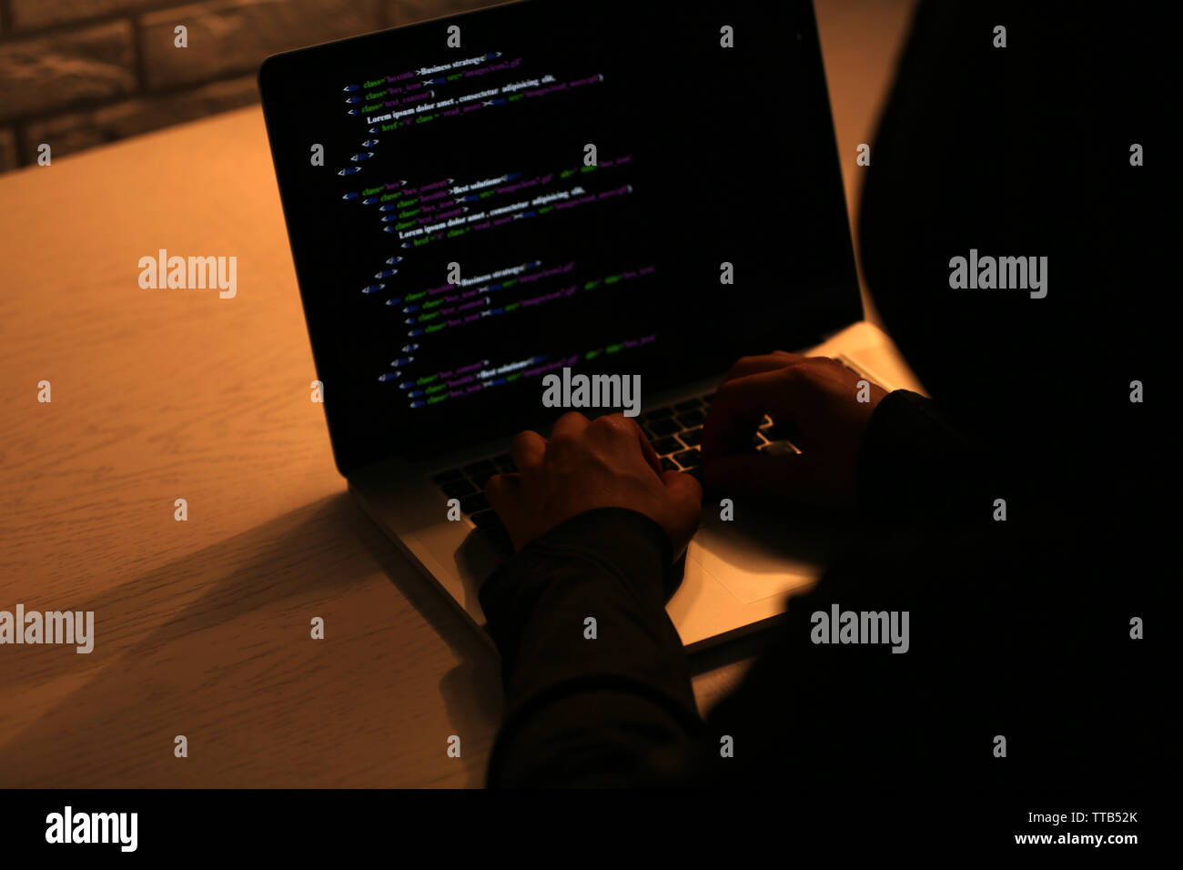 Hacker with laptop Stock Photo - Alamy