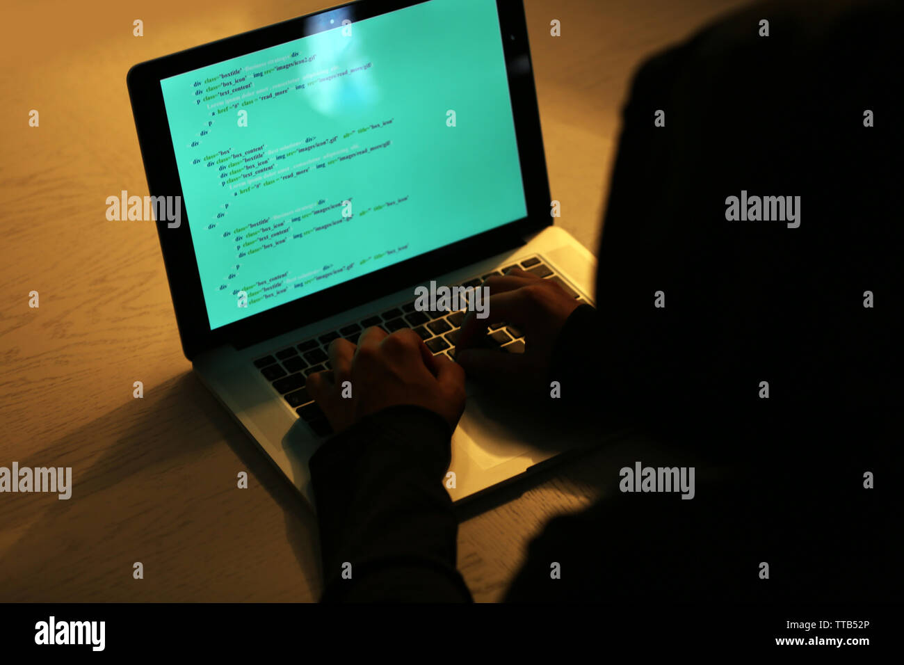 Hacker with laptop Stock Photo - Alamy