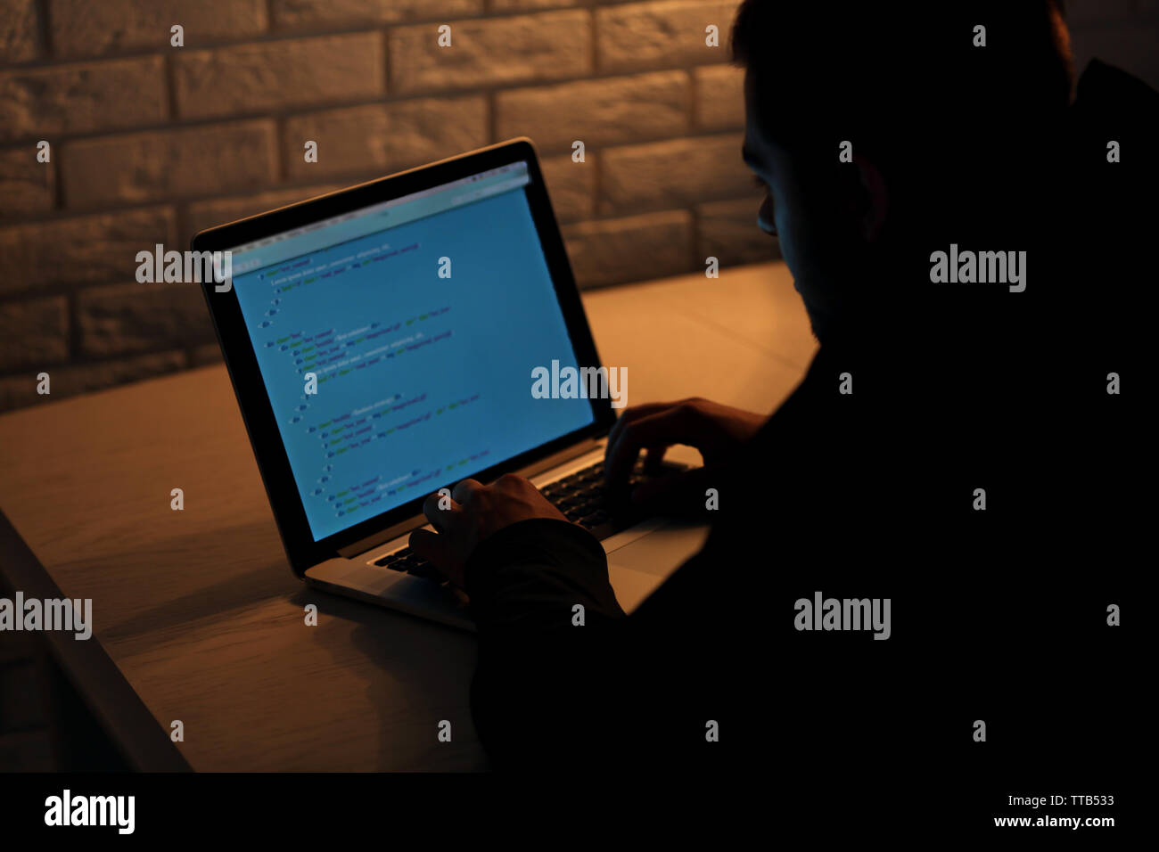 Hacker with laptop Stock Photo - Alamy