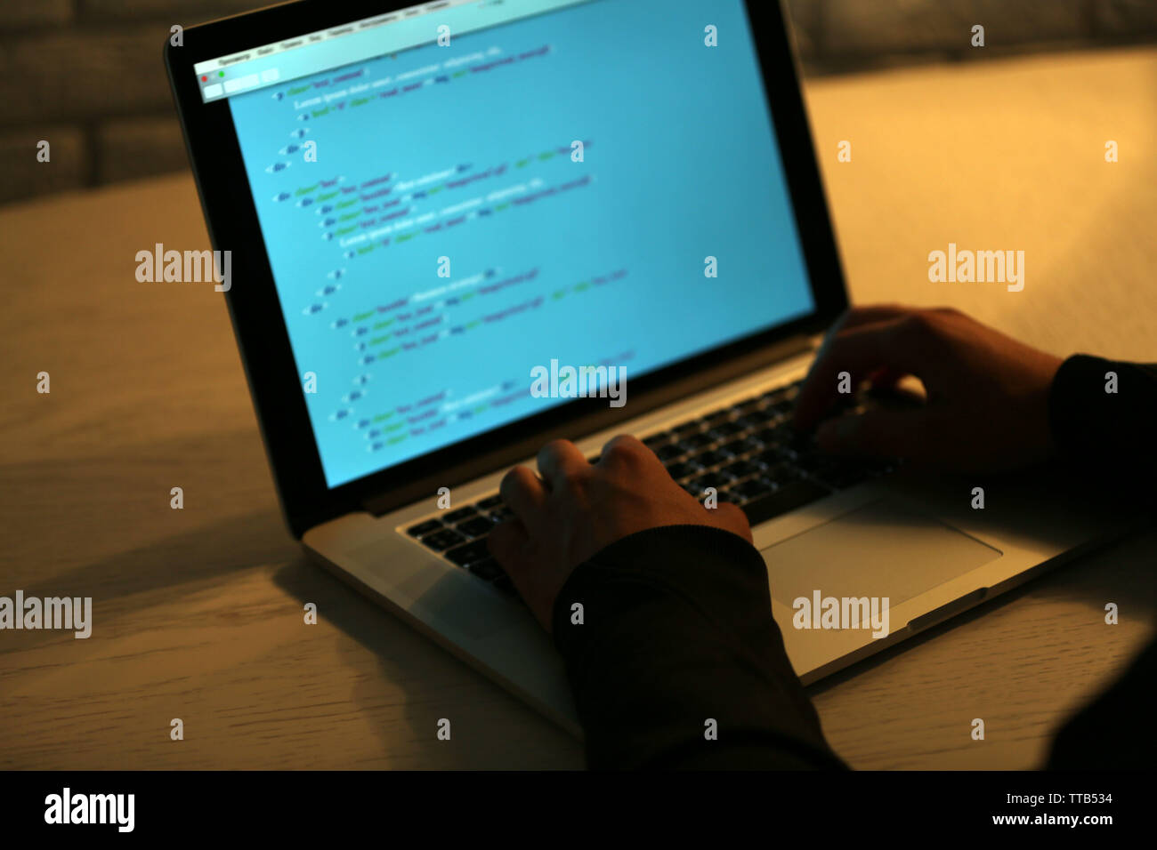 Hacker with laptop Stock Photo - Alamy
