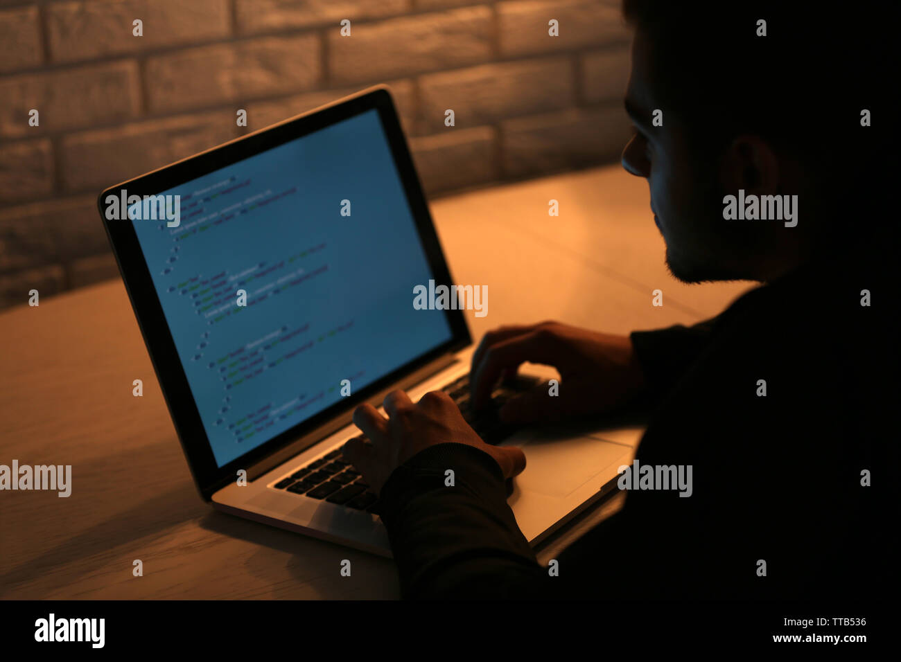 Hacker with laptop Stock Photo - Alamy