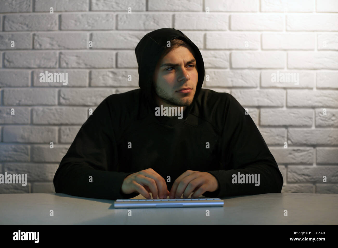 Hacker with laptop Stock Photo - Alamy