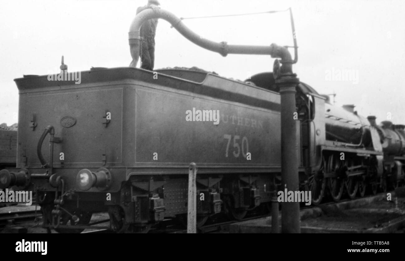 Southern Railway locomotive filling with water Stock Photo - Alamy