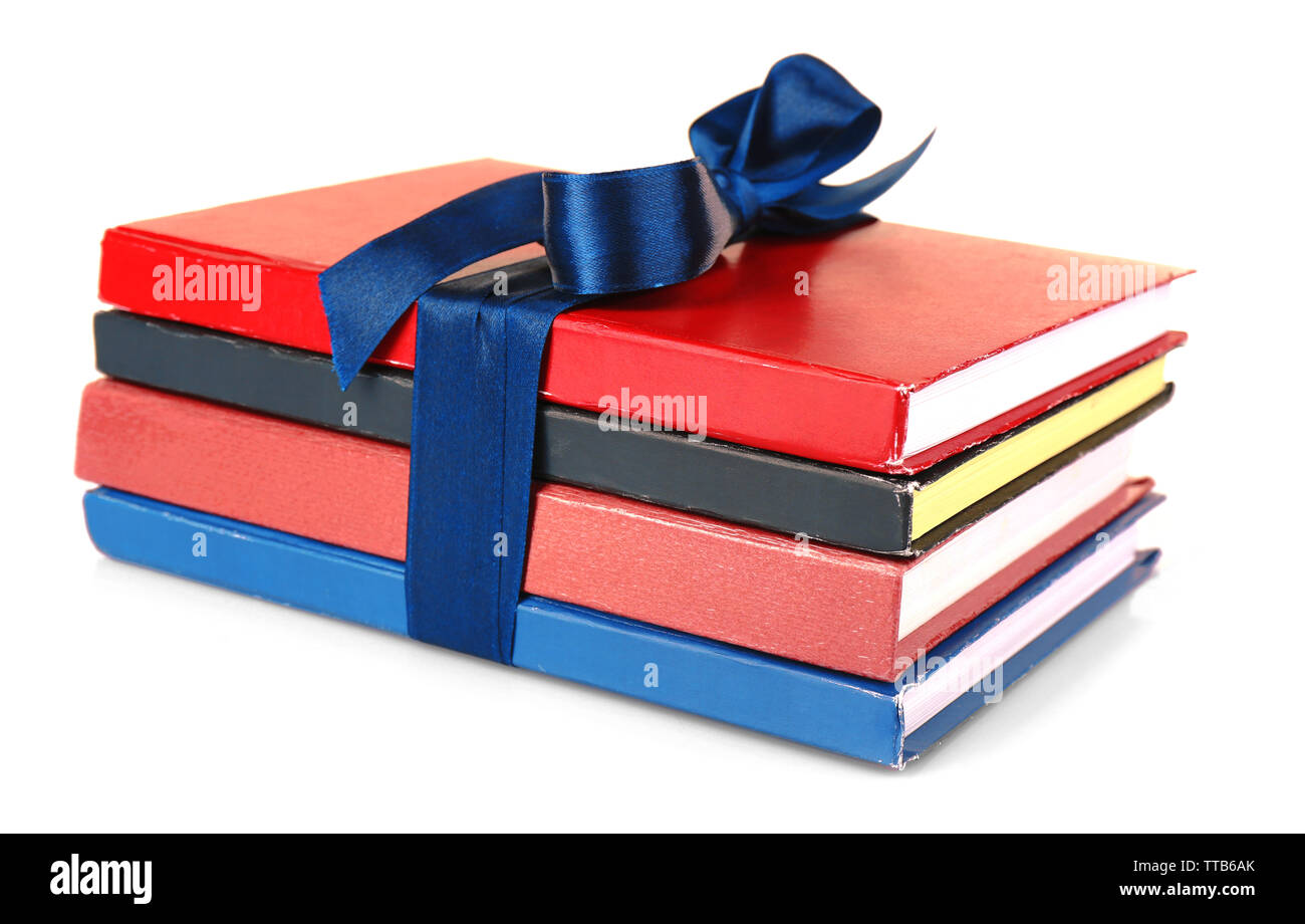 Stack of books with ribbon isolated on white Stock Photo - Alamy