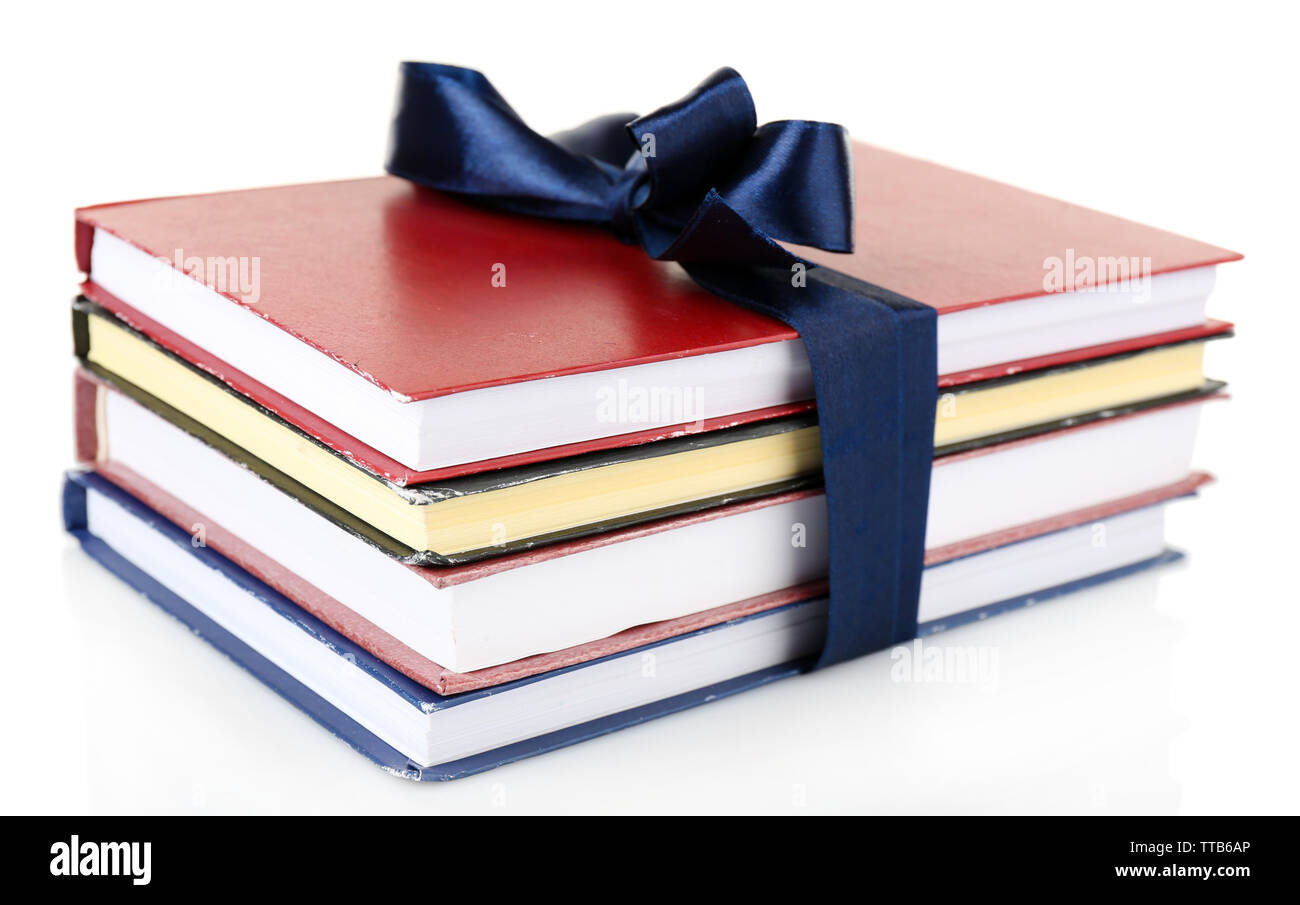 Stack of books with ribbon isolated on white Stock Photo - Alamy