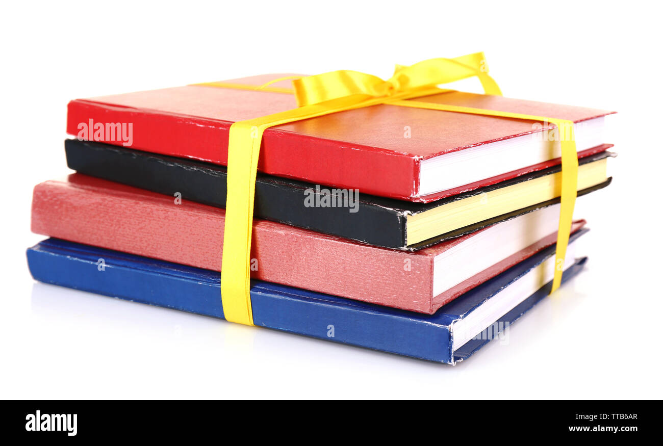 Stack of books with ribbon isolated on white Stock Photo - Alamy