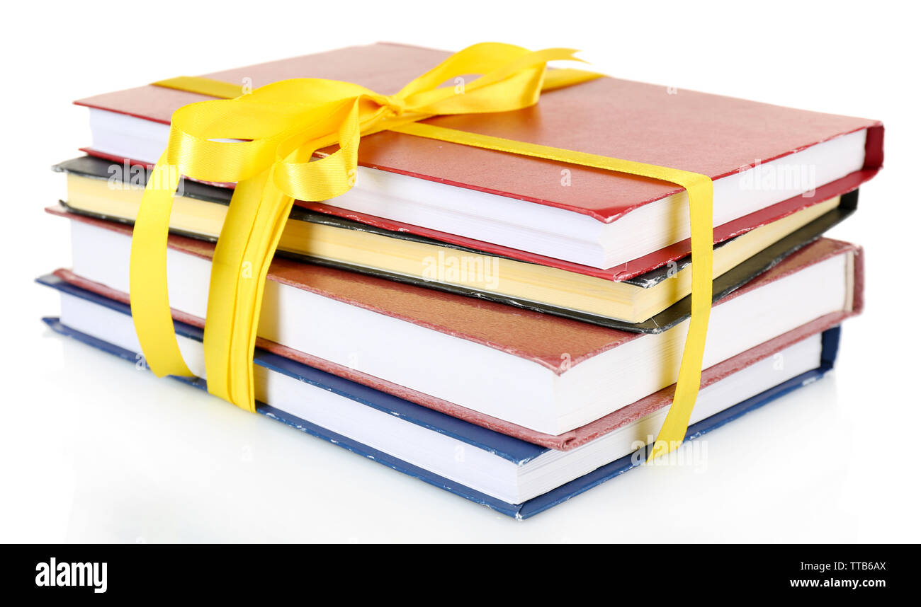 Stack of books with ribbon isolated on white Stock Photo - Alamy