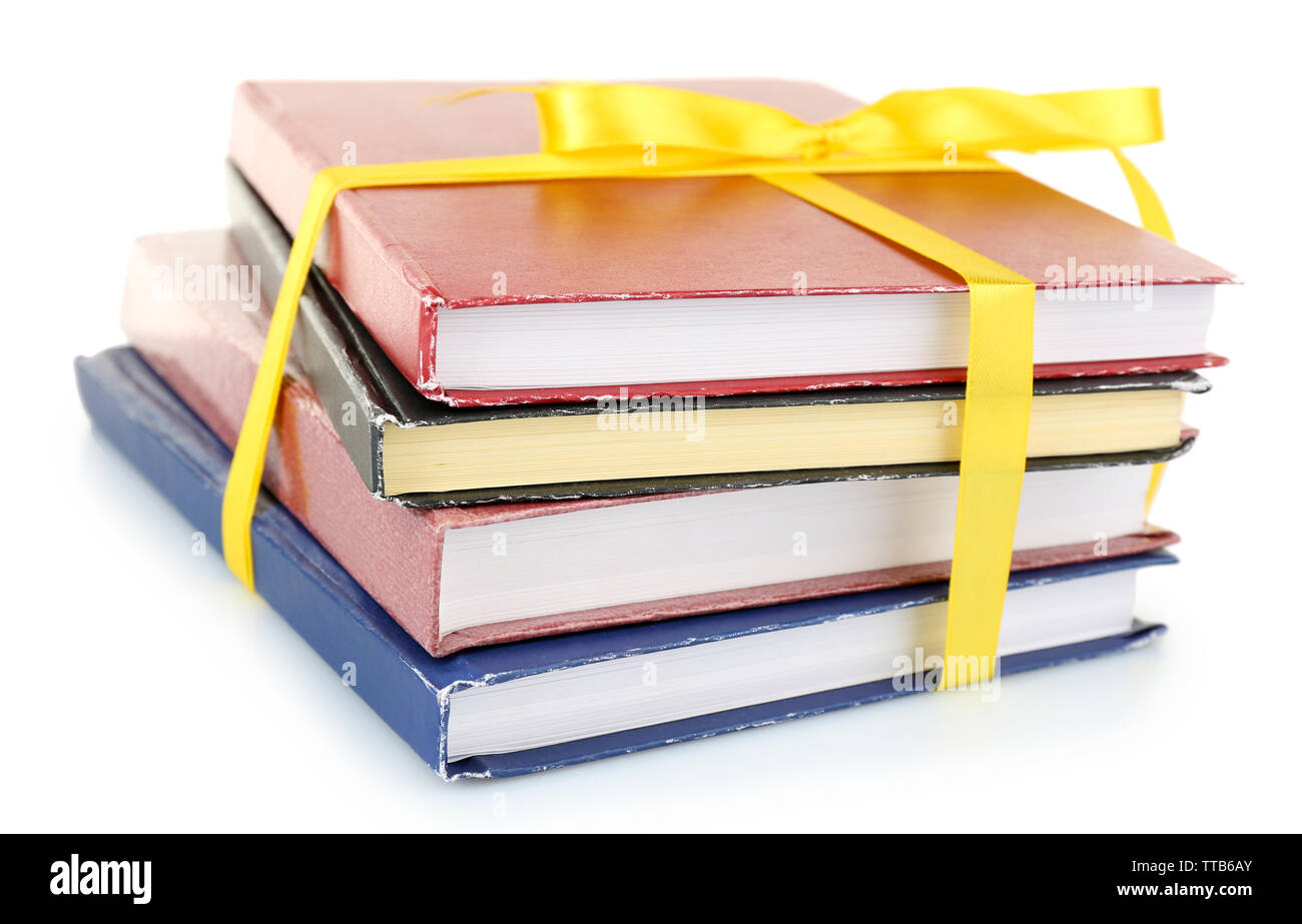 Stack of books with ribbon isolated on white Stock Photo - Alamy