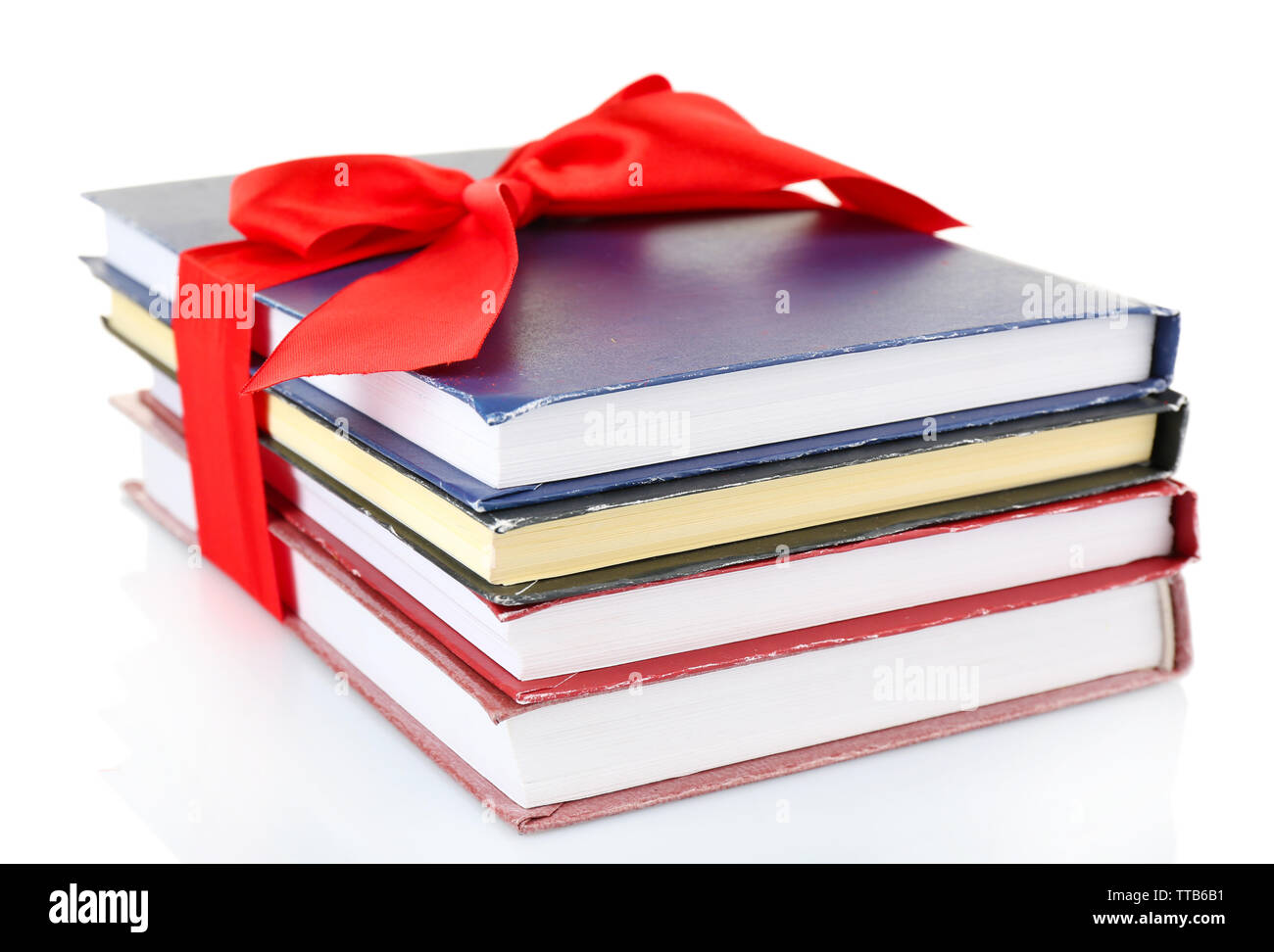 Stack of books with ribbon isolated on white Stock Photo - Alamy
