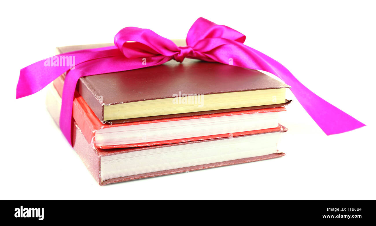 Stack of books with ribbon isolated on white Stock Photo - Alamy