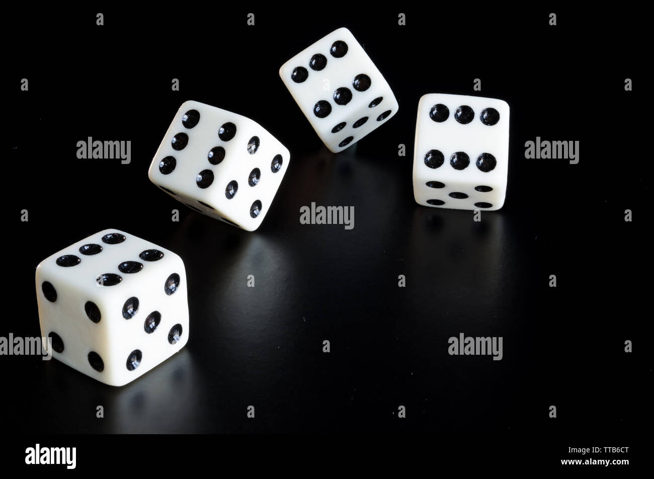 Thrown the dice on black background with reflection Stock Photo - Alamy