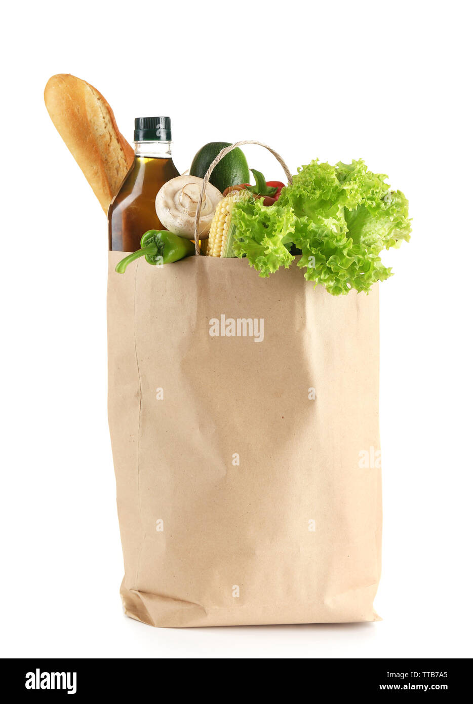 Paper bag with food isolated on white Stock Photo - Alamy