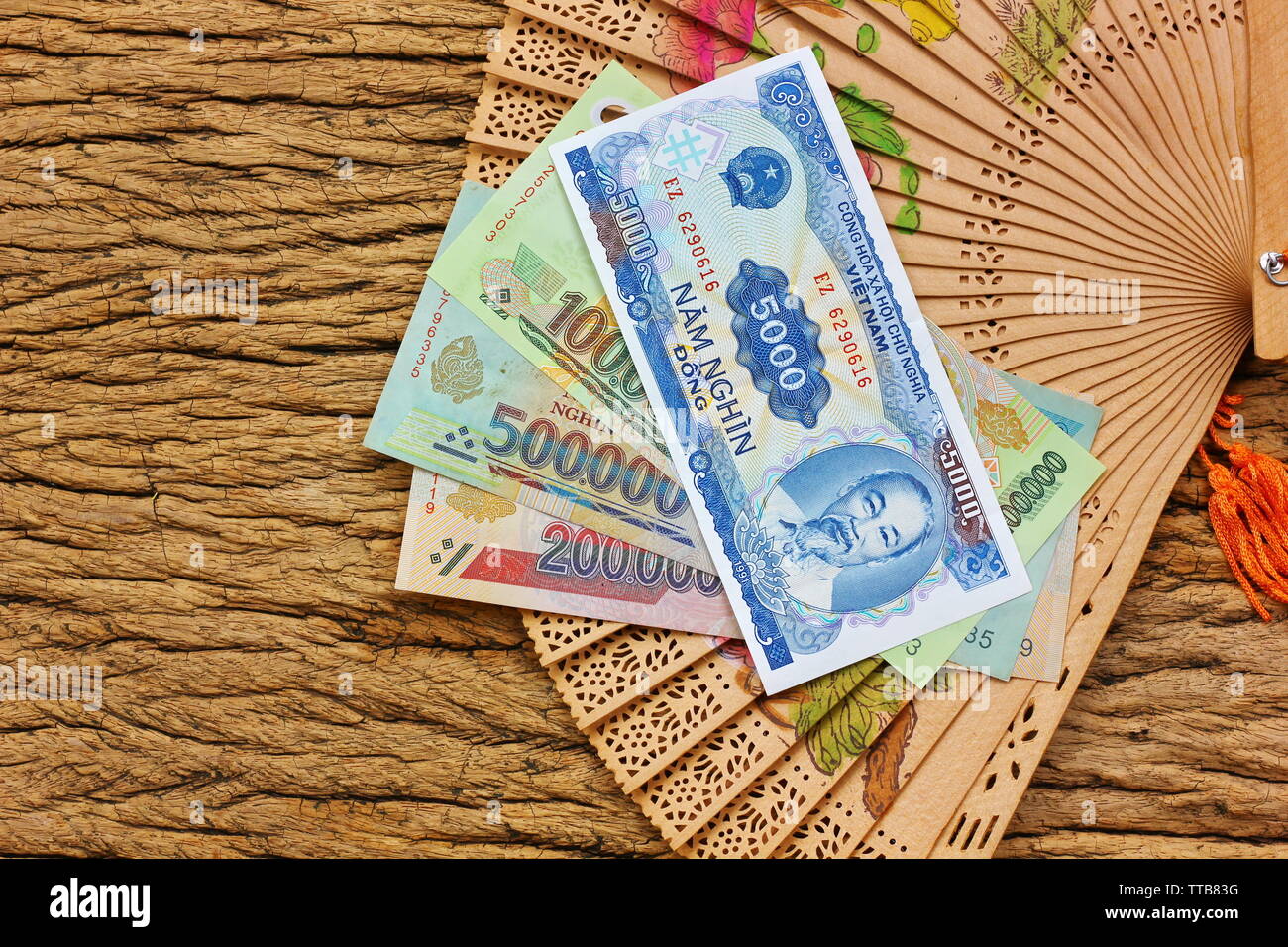 Dong ,Vietnam money bank note with vintage Chinese wood fan Stock Photo ...