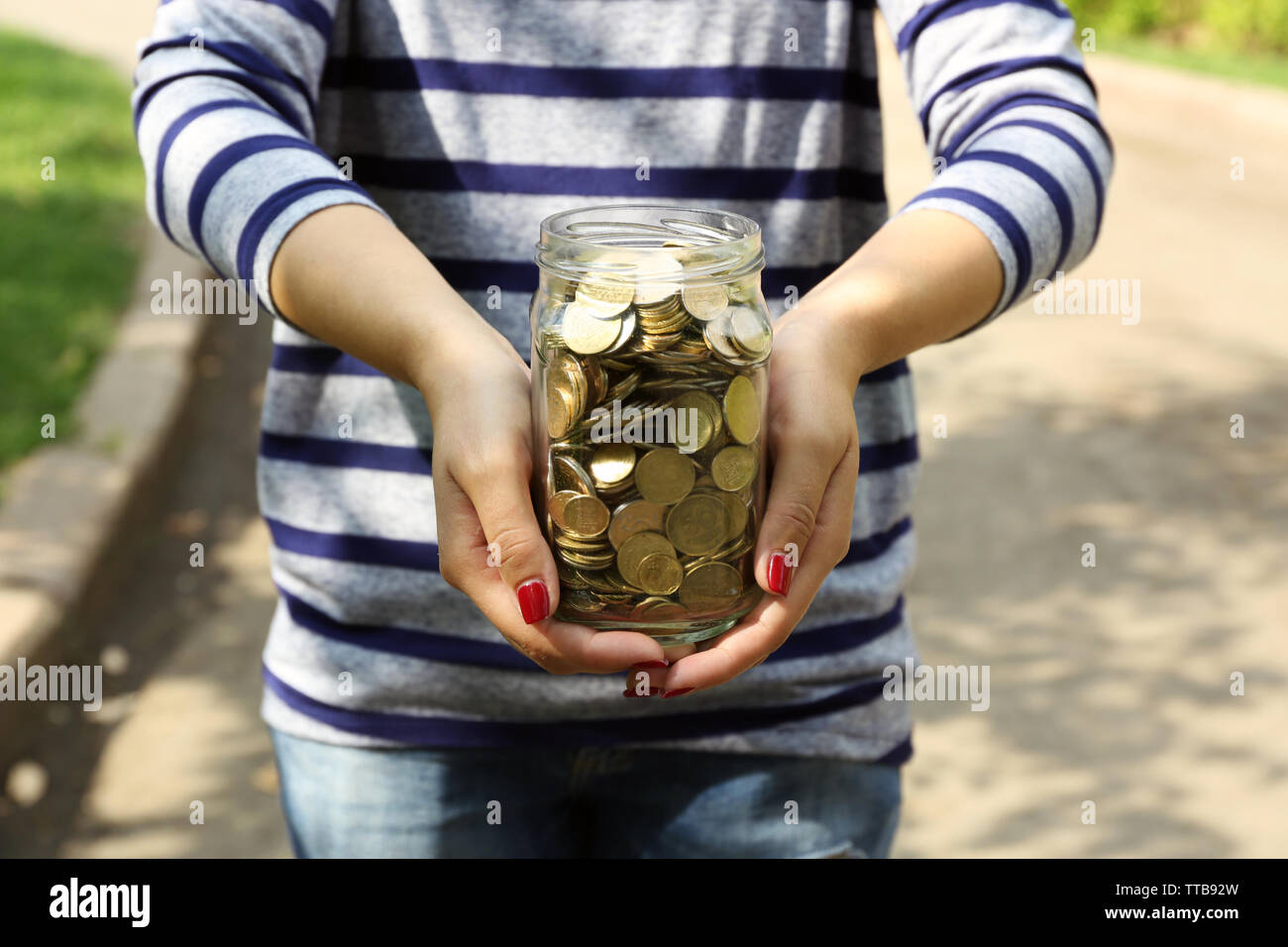 Money jar outdoors hi-res stock photography and images - Alamy