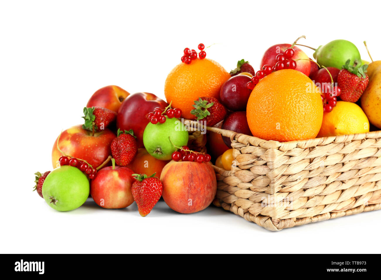 Heap of fresh fruits and berries in basket isolated on white Stock ...