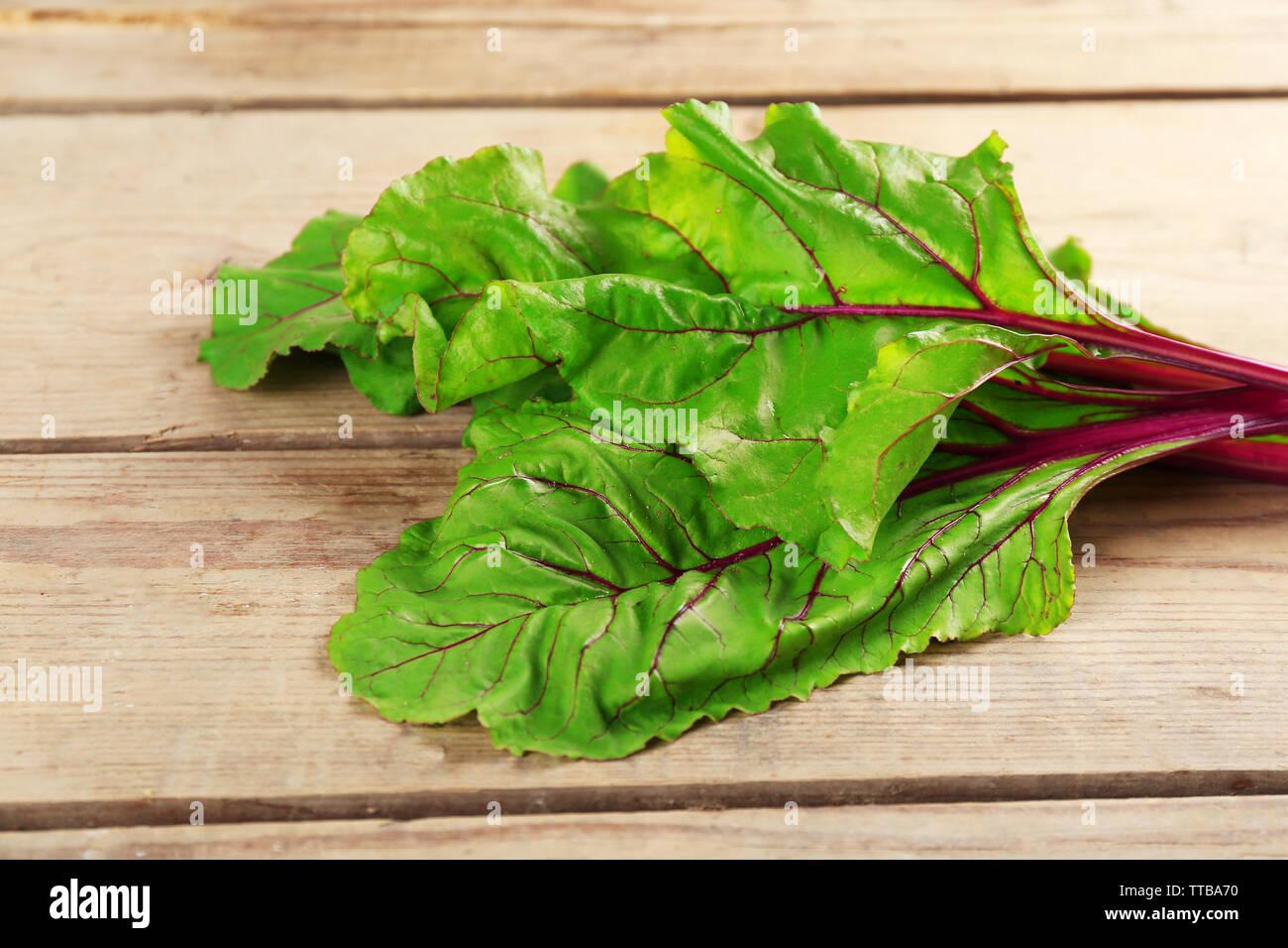 Fresh swiss chard on wooden table, close up Stock Photo - Alamy