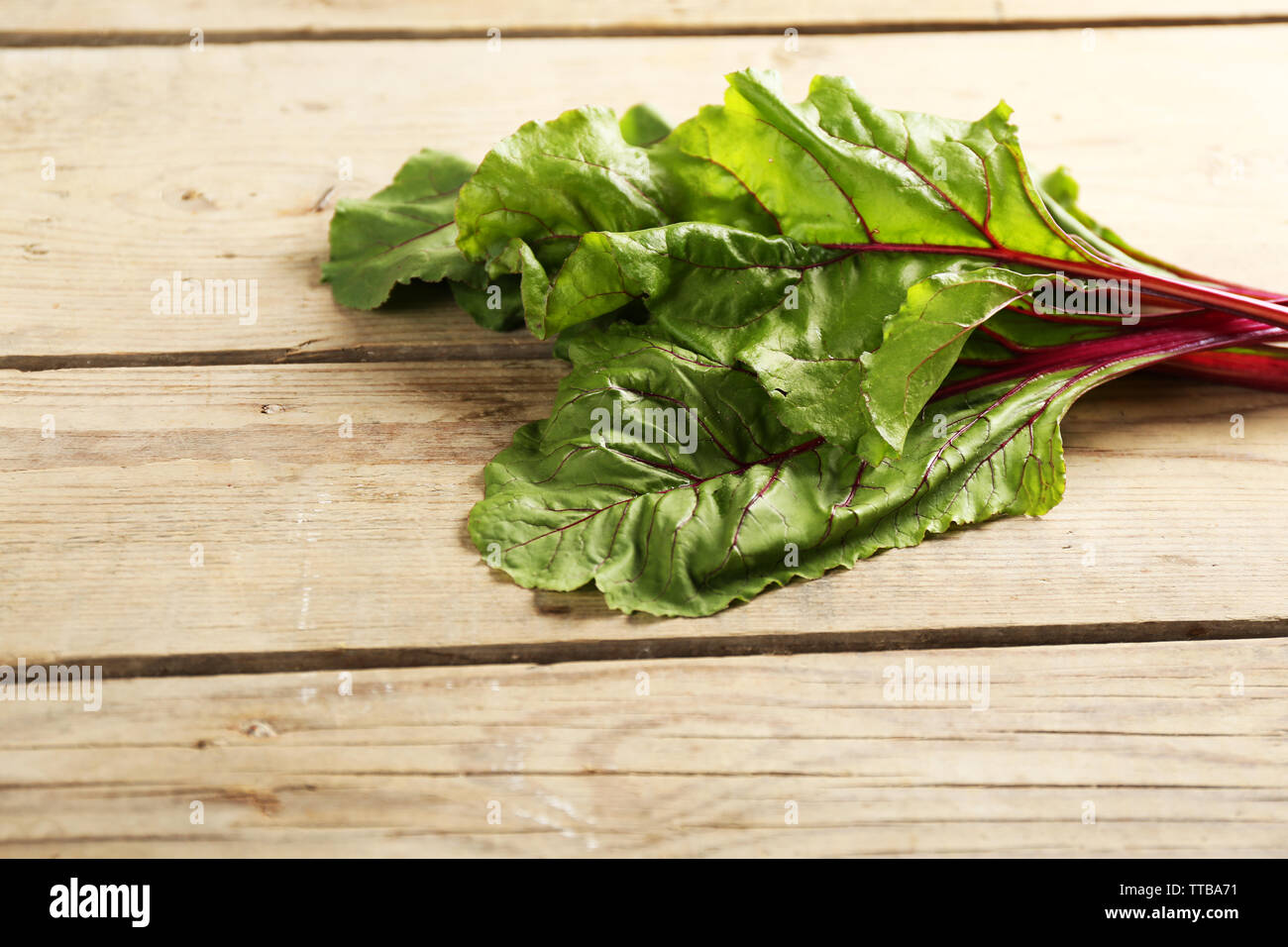 Fresh swiss chard on wooden table, close up Stock Photo - Alamy