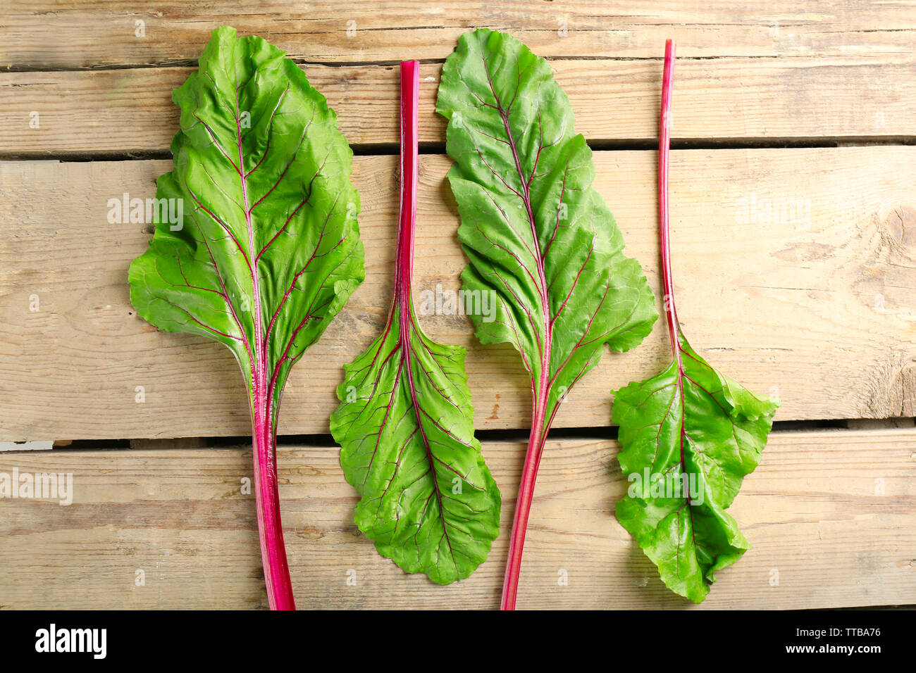 Fresh swiss chard on wooden table, close up Stock Photo - Alamy