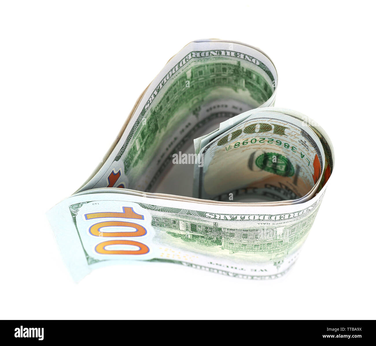 Money in form of heart isolated on white Stock Photo - Alamy