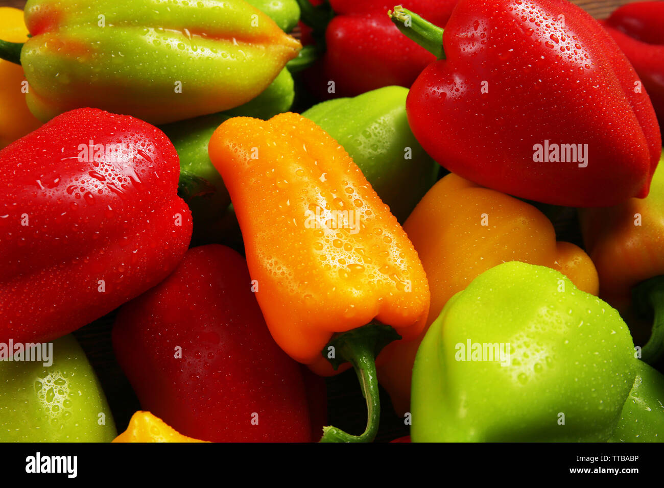 Colorful peppers background Stock Photo - Alamy