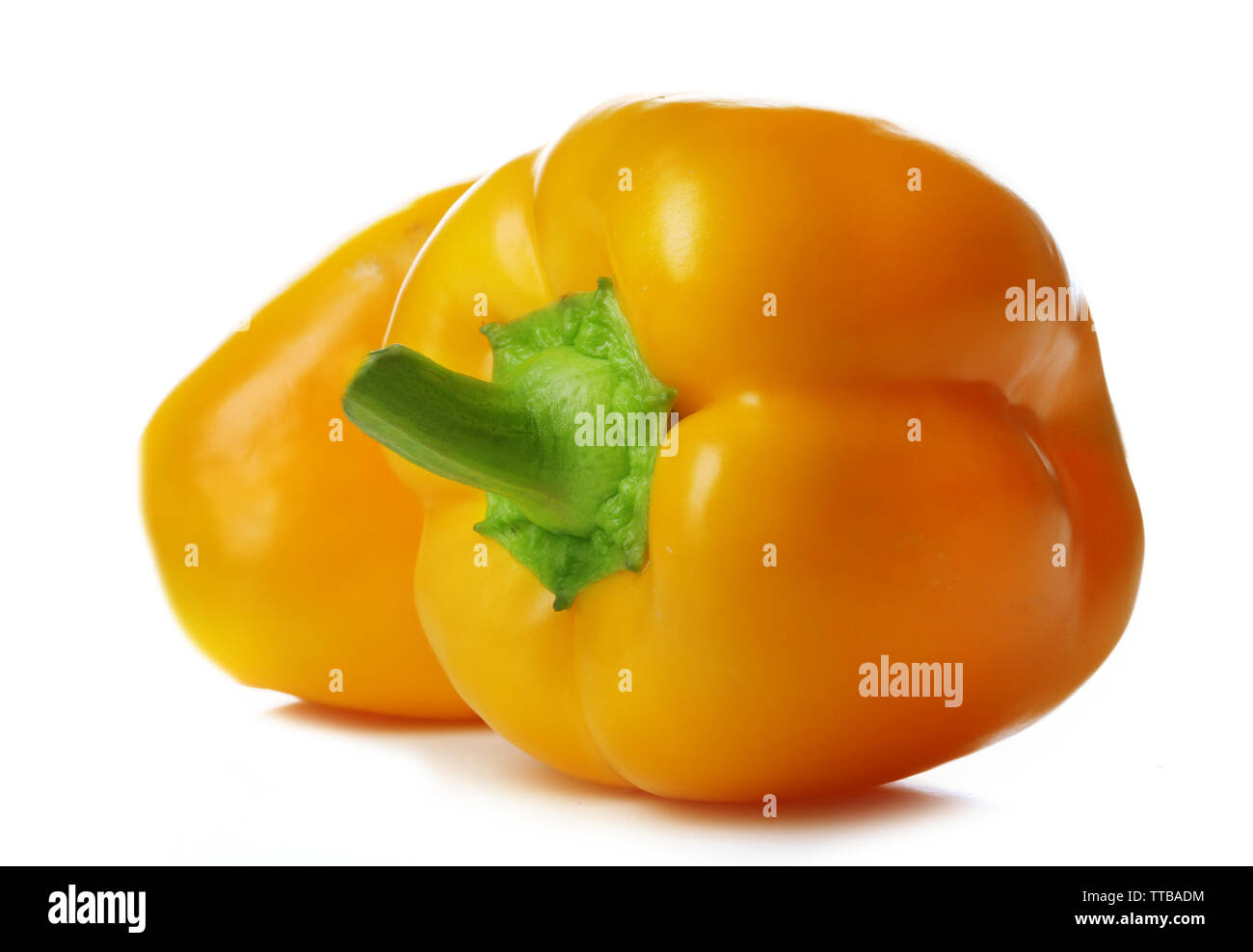 Group of yellow peppers isolated on white Stock Photo - Alamy