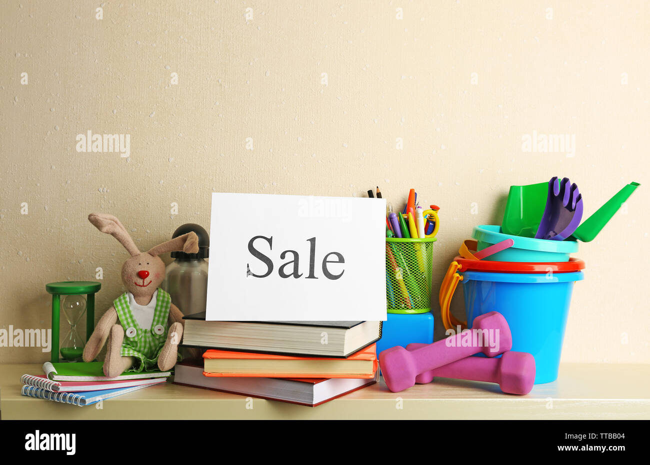 Goods for sale, on light wall background Stock Photo - Alamy