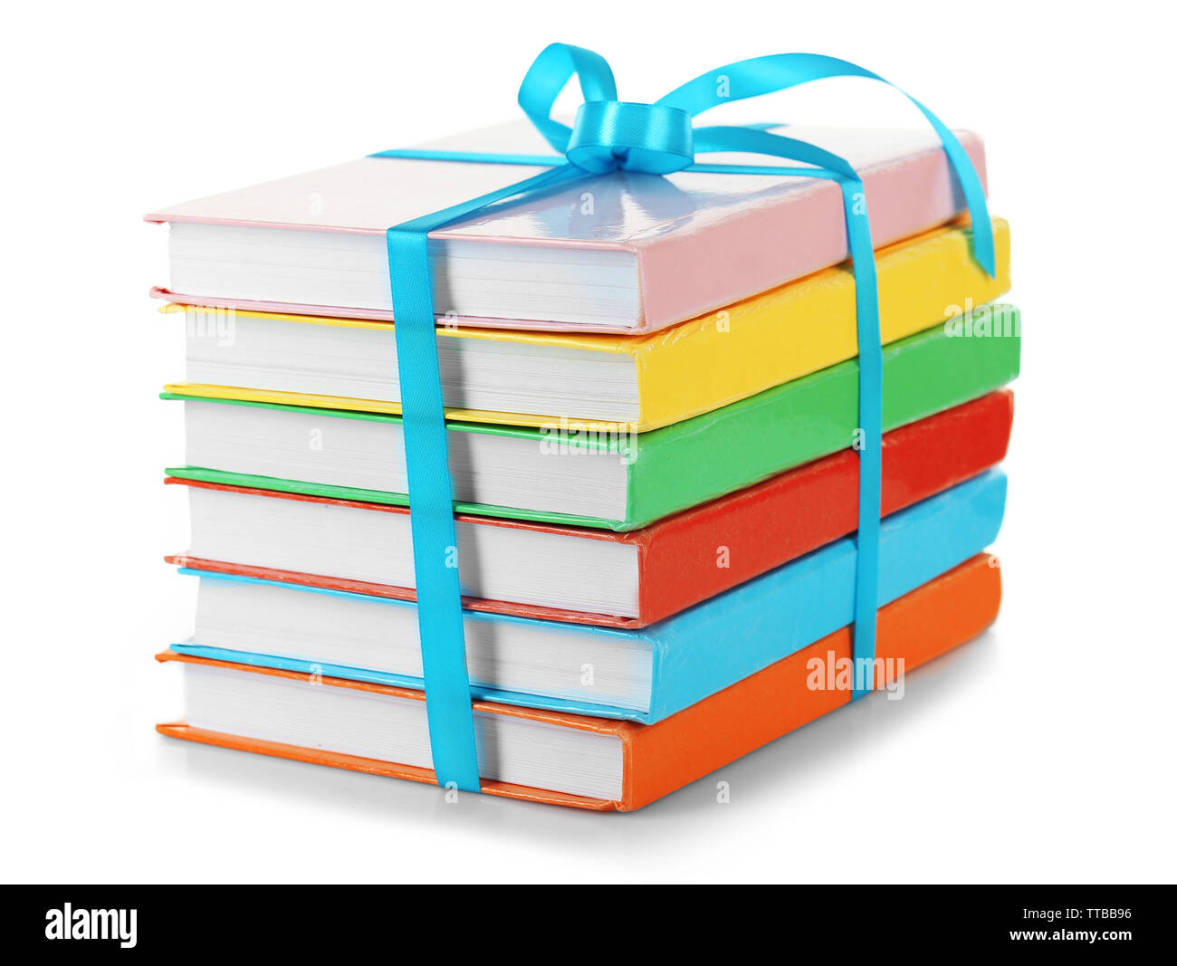 Stack of books with ribbon isolated on white Stock Photo - Alamy
