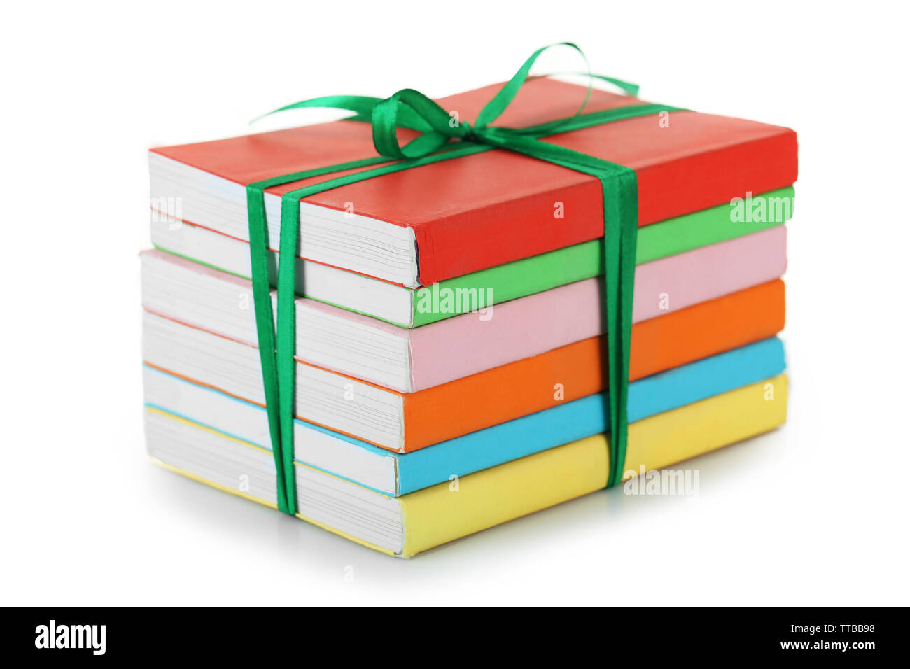 Stack of books with ribbon isolated on white Stock Photo - Alamy