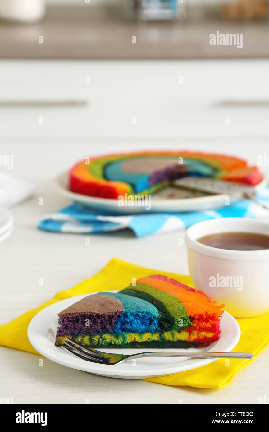 Delicious rainbow cake on plate, on light background Stock Photo - Alamy