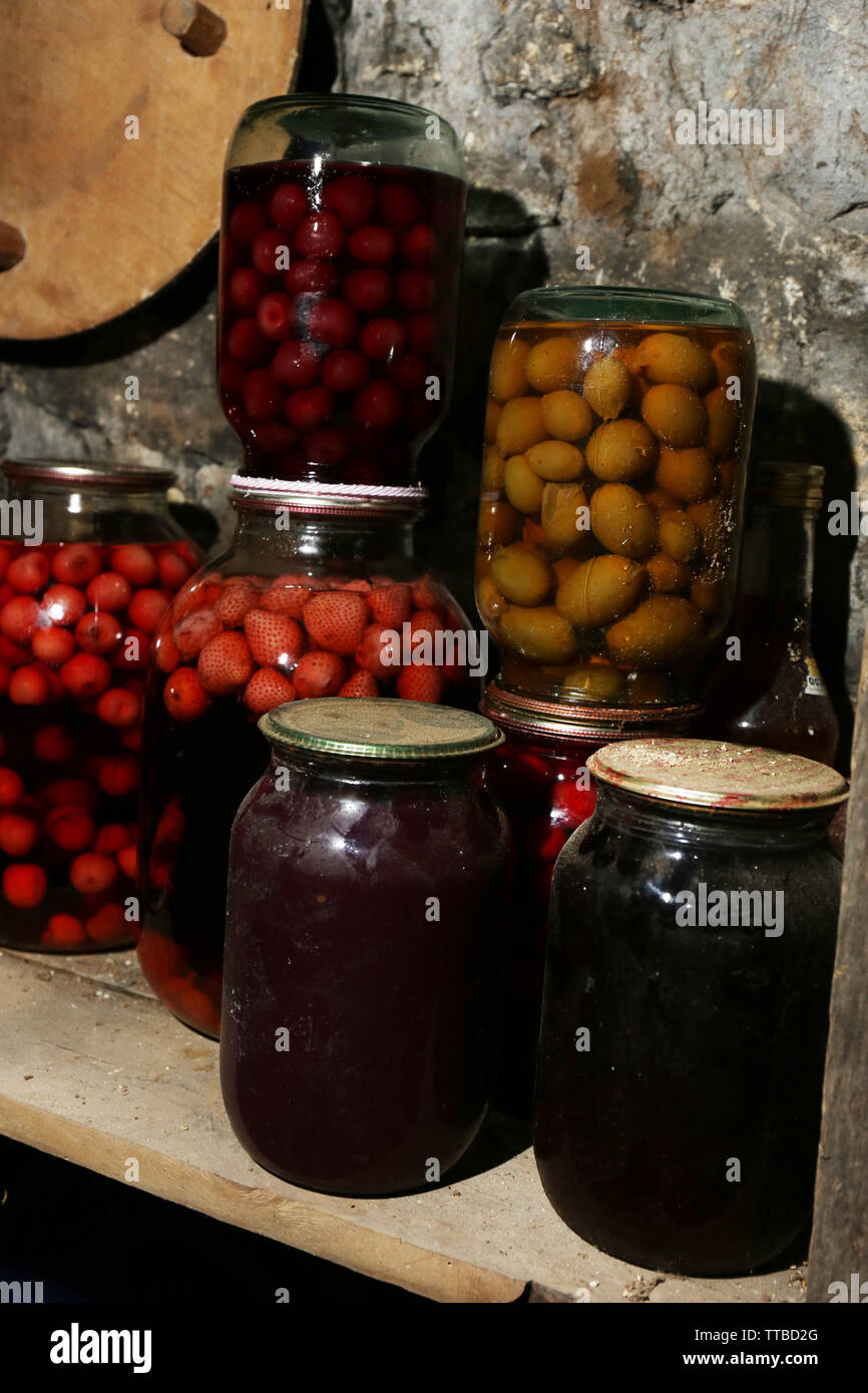 Home preservation in glass jars in cellar, closeup Stock Photo - Alamy