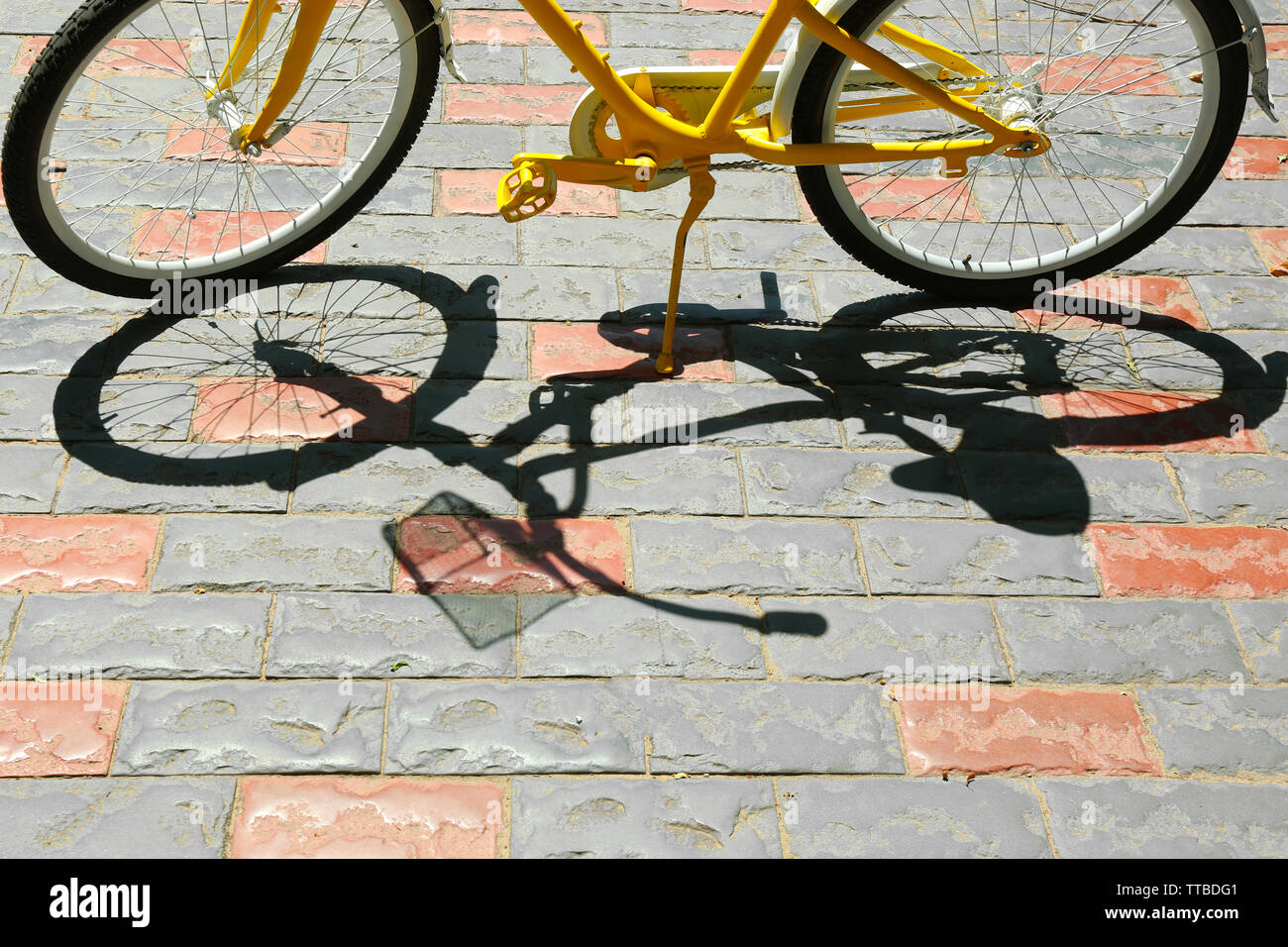 Bicycle over pavement background Stock Photo - Alamy