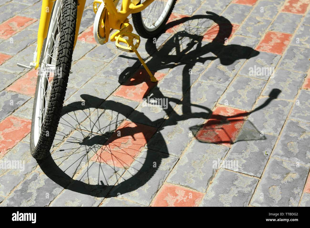 Bicycle over pavement background Stock Photo - Alamy