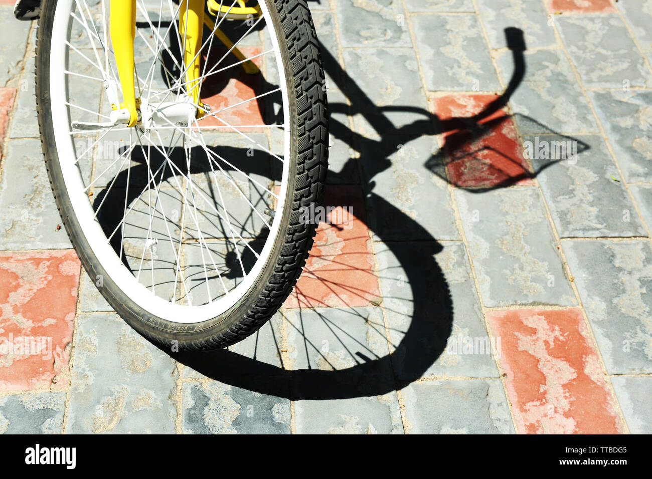 Bicycle over pavement background Stock Photo - Alamy