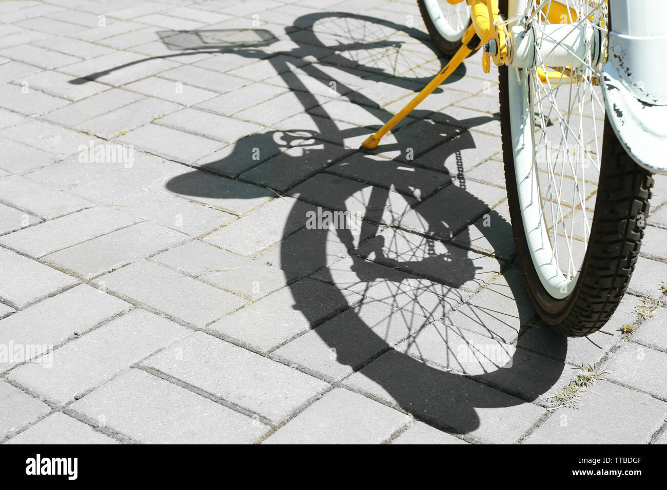 Bicycle over pavement background Stock Photo - Alamy