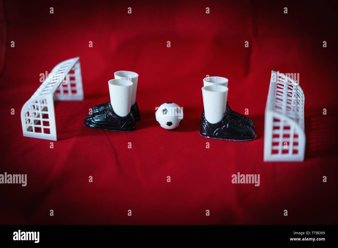 toy soccer field in red Stock Photo - Alamy