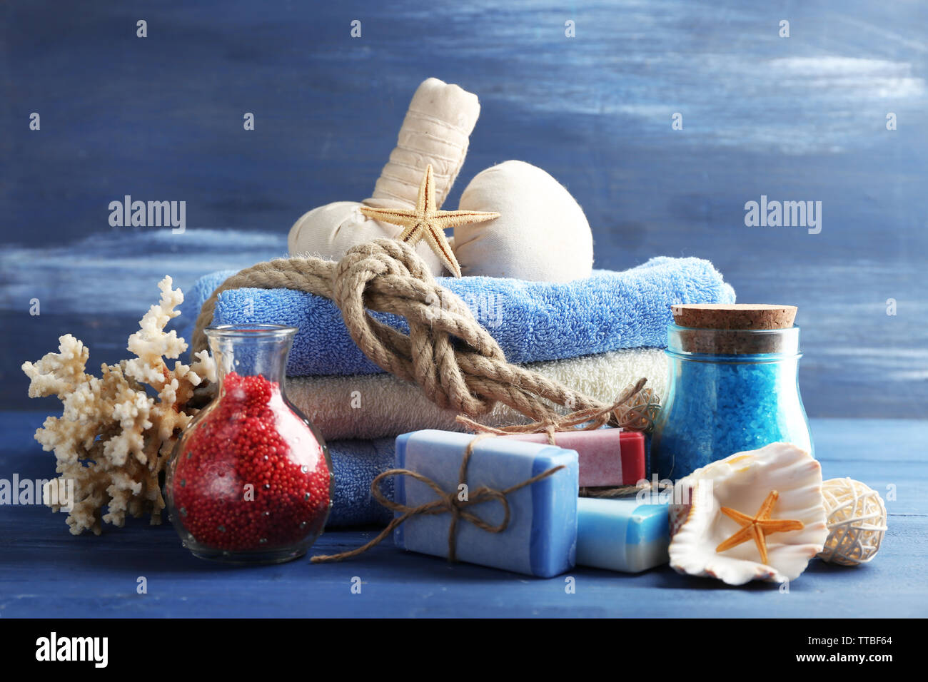Spa treatments on blue background. Sea spa concept Stock Photo - Alamy