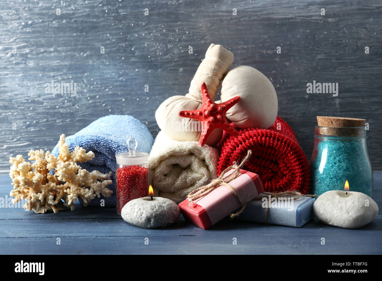 Spa treatments on blue background. Sea spa concept Stock Photo - Alamy
