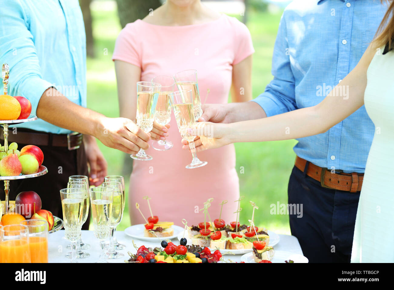 Guests drink champagne on wedding ceremony Stock Photo - Alamy