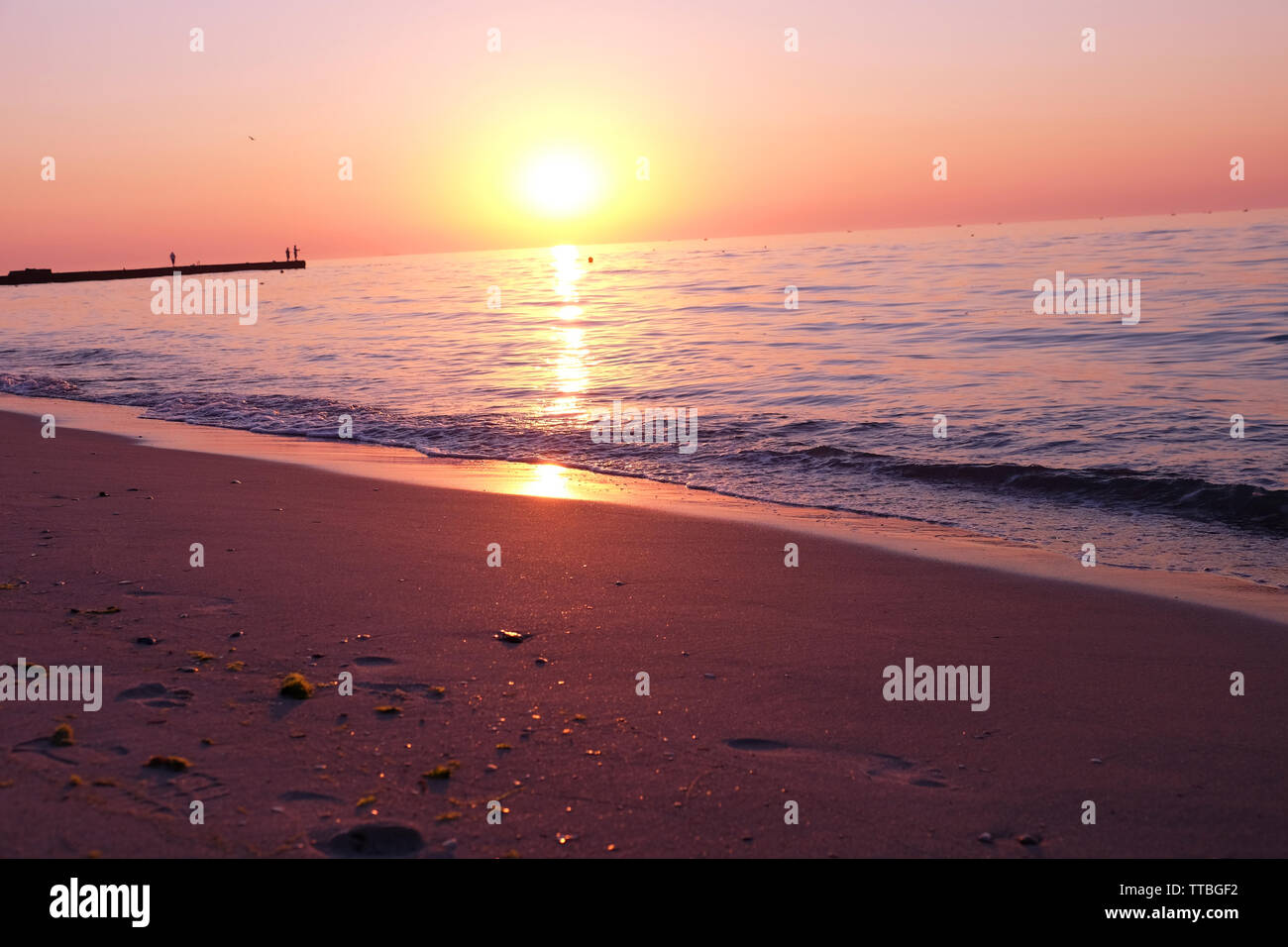 View of beautiful sunrise on the beach Stock Photo - Alamy