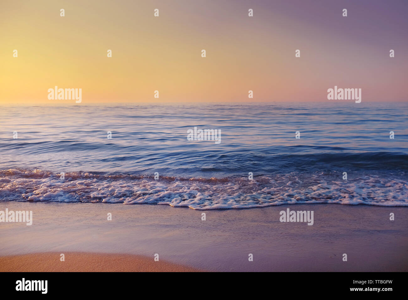 View of beautiful sunrise on the beach Stock Photo - Alamy