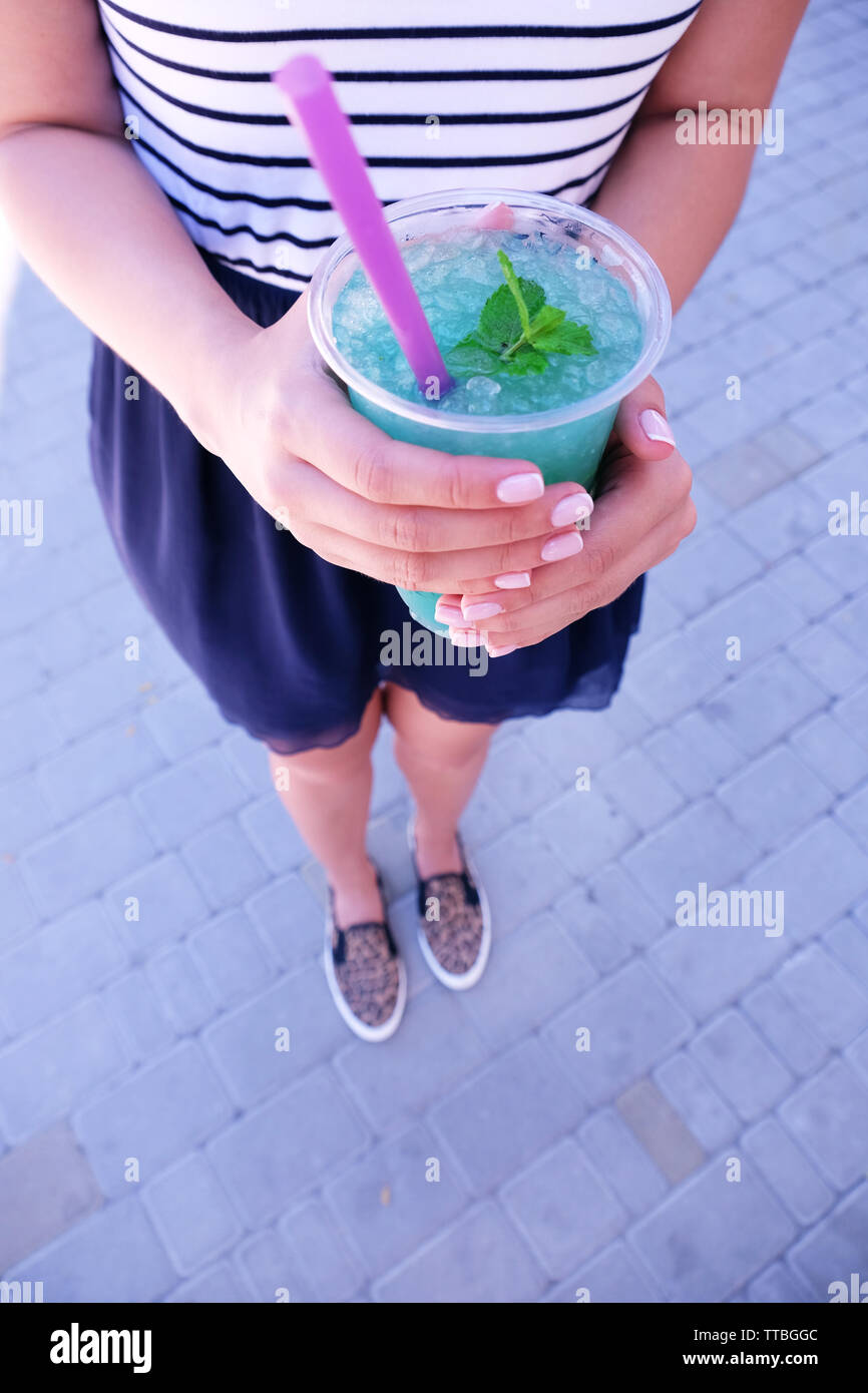 Refreshing cocktail in hand Stock Photo - Alamy