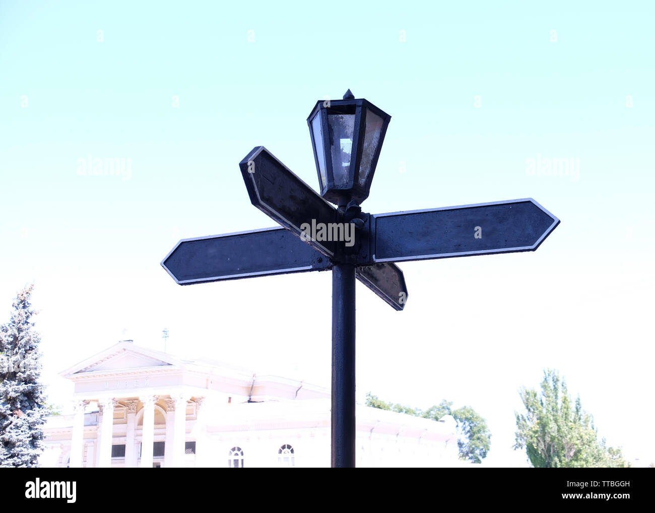 Street sign arrow on nature background Stock Photo - Alamy