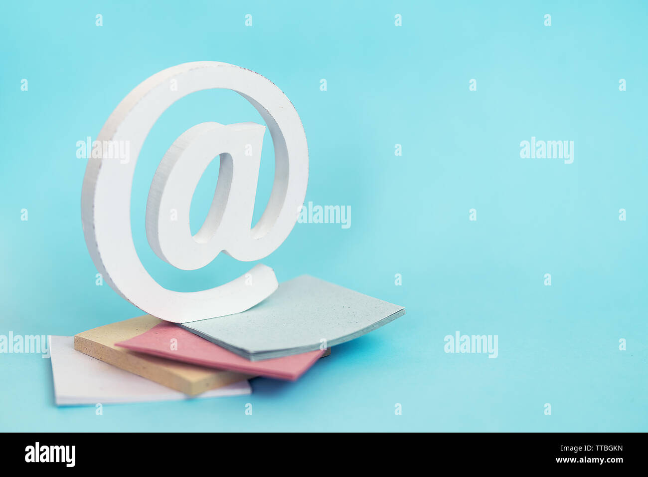 email sign on a stack of stickers on blue background Concept for email ...